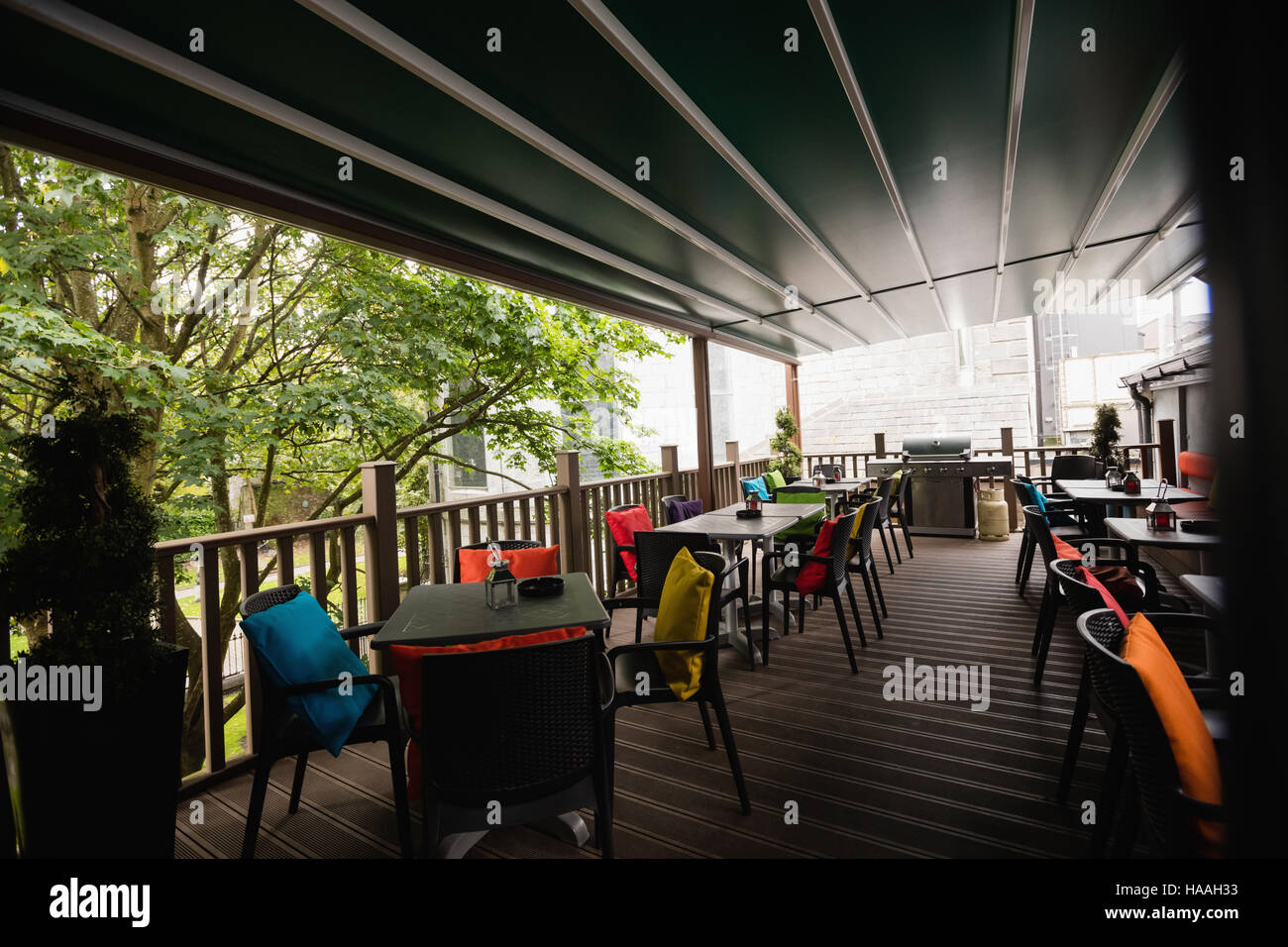 Tables and chairs in bar Stock Photo - Alamy