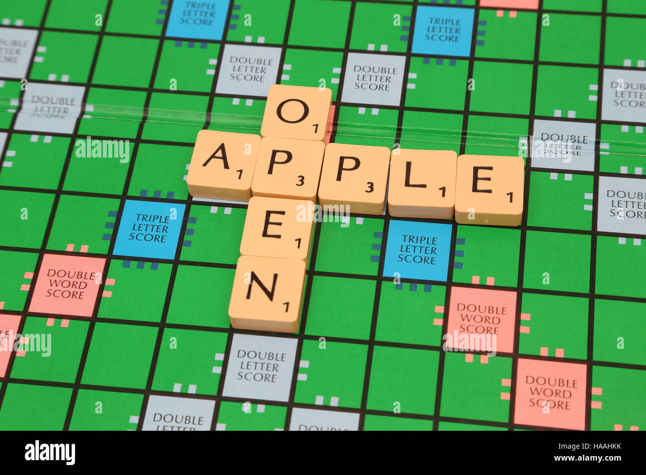 Scrabble Board Game Tiles On Board "Open Apple Stock Photo - Alamy