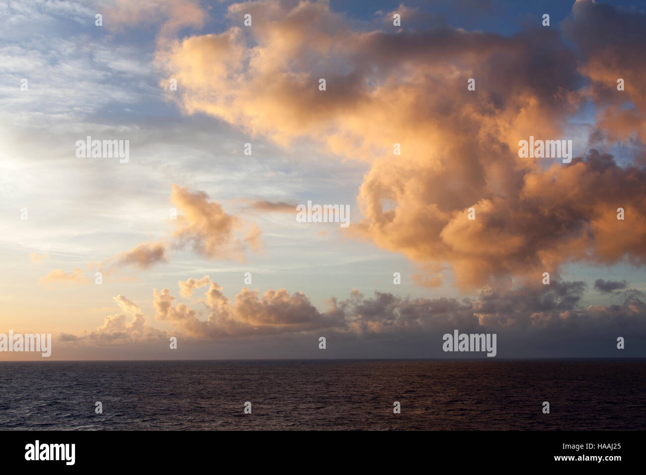 The sunrise painted cloudscape over Pacific Ocean Stock Photo - Alamy