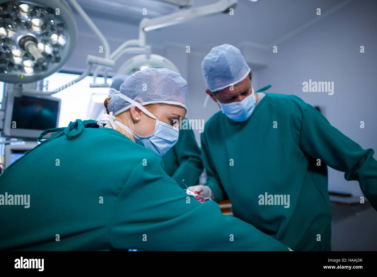 Surgeons performing operation in operation theater Stock Photo - Alamy