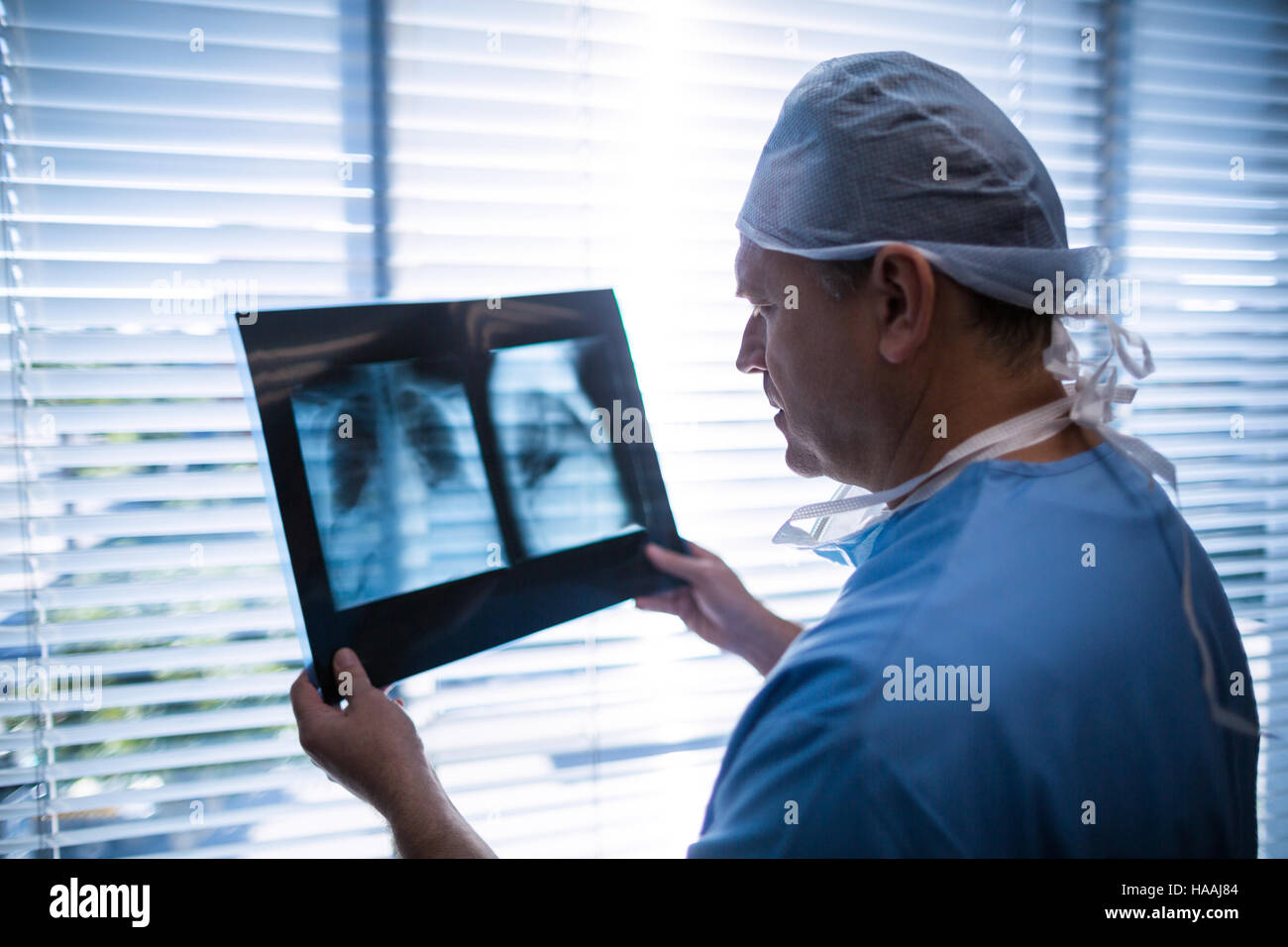 Male surgeon examining x-ray Stock Photo - Alamy
