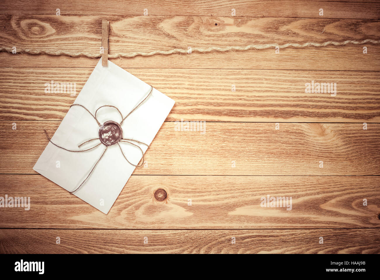 Mail envelope on rope Stock Photo - Alamy