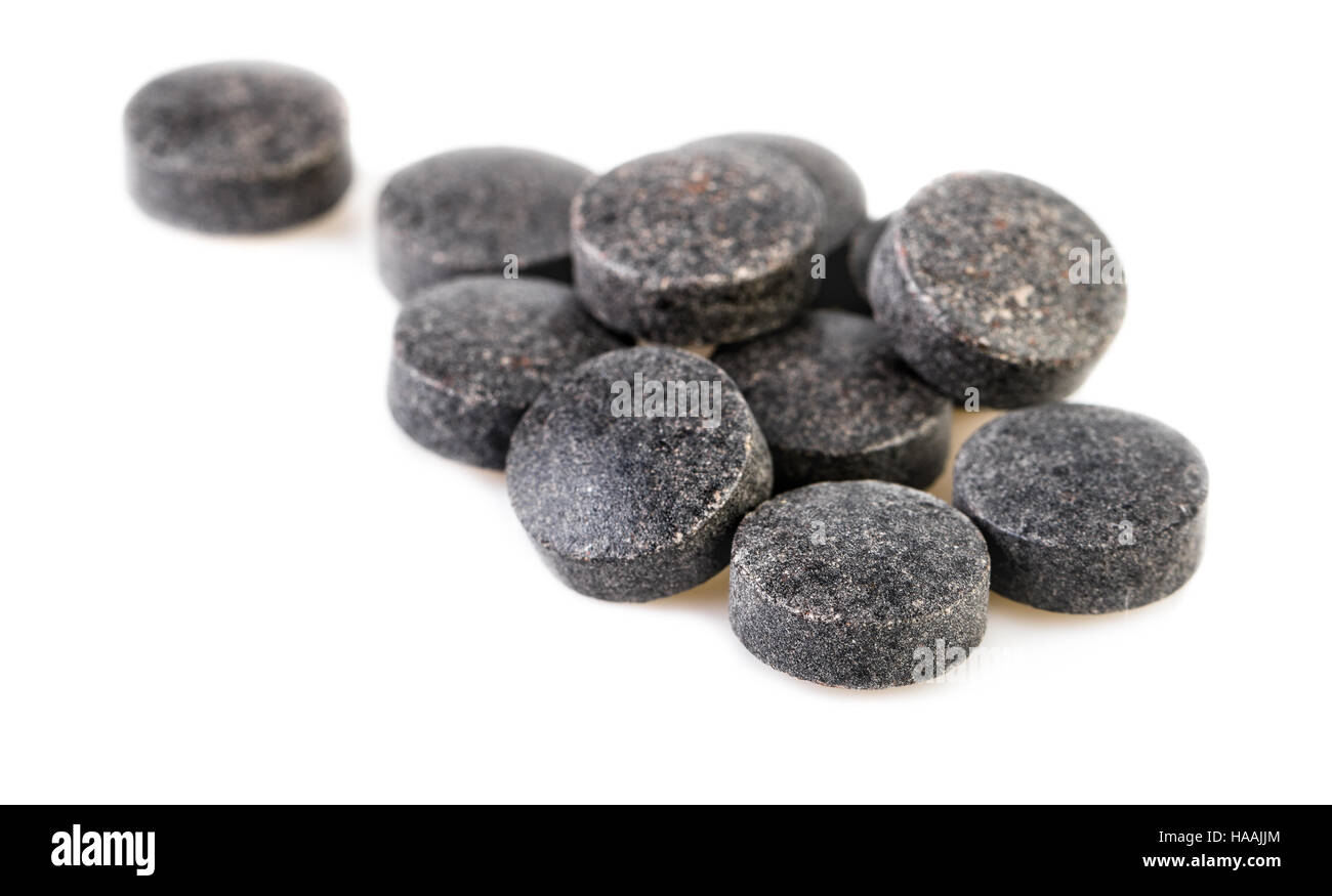 iron tablets isolated on white closeup Stock Photo - Alamy