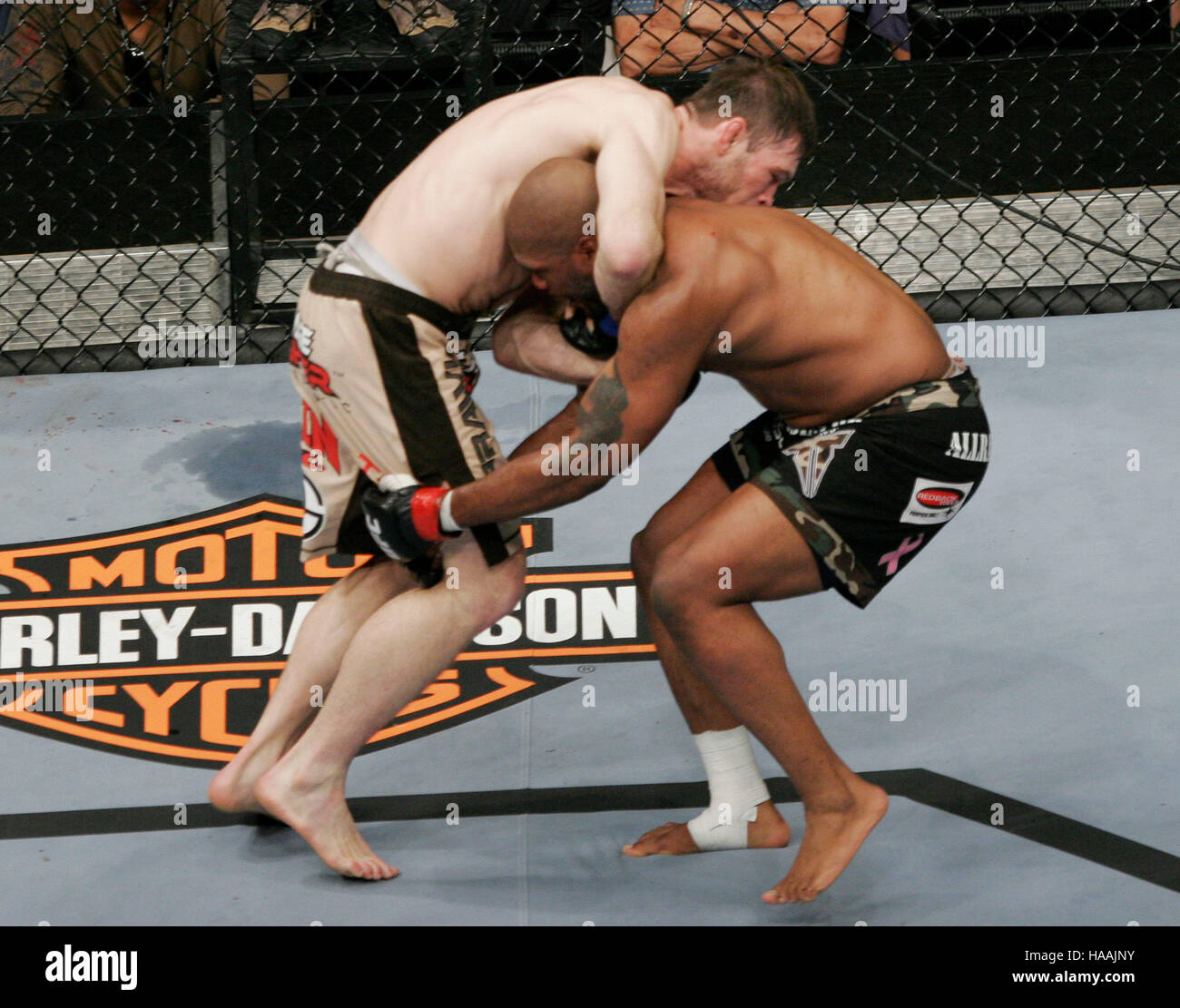 Forrest Griffin (tan shorts) fights Quinton Jackson (black shorts ...