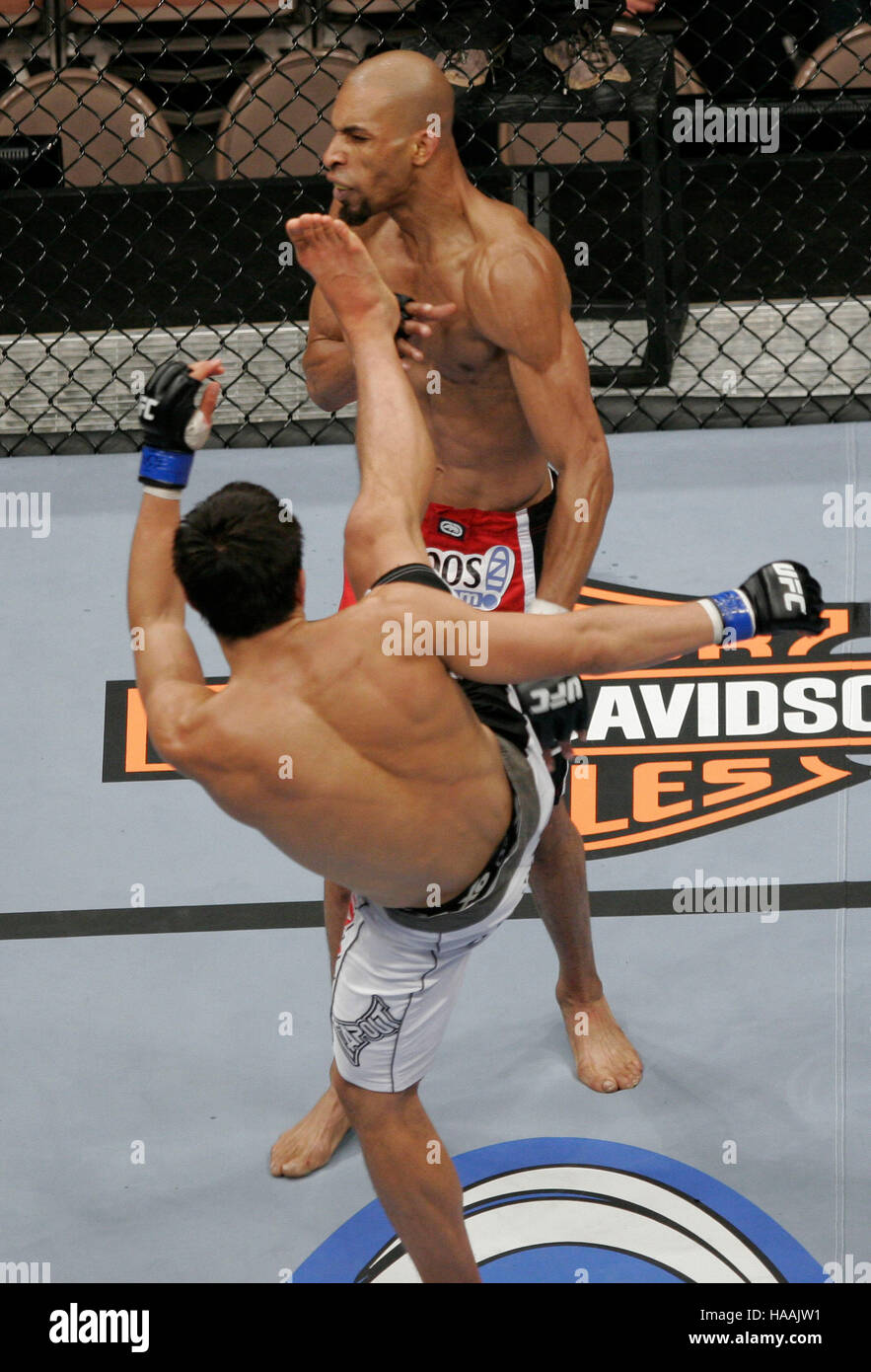 Justin Buchholz (white shorts) fights Corey Hill (red shorts) during ...
