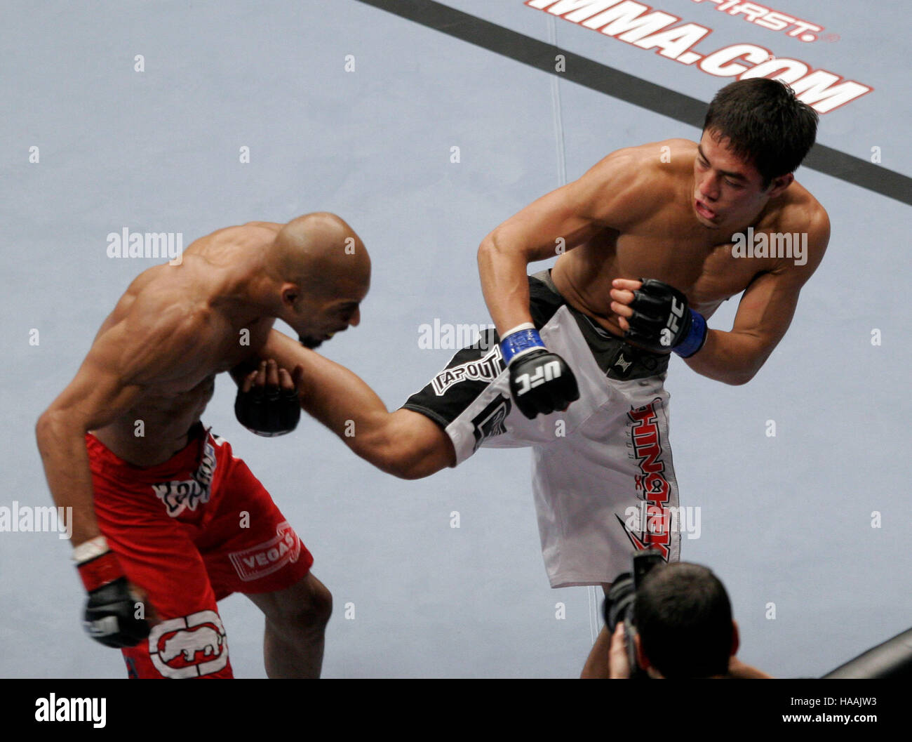 Justin Buchholz (white shorts) fights Corey Hill (red shorts) during ...