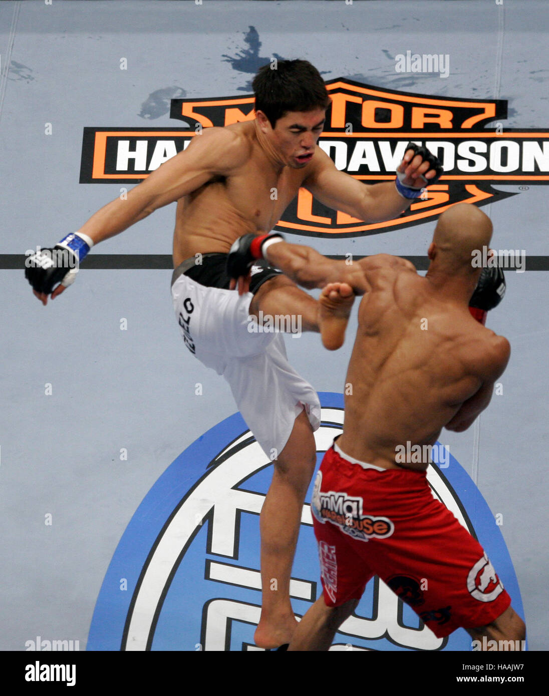 Justin Buchholz (white shorts) fights Corey Hill (red shorts) during ...