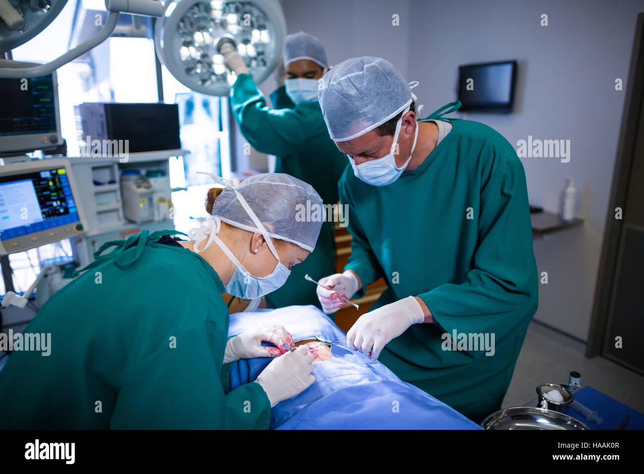 Surgeons performing operation in operation theater Stock Photo - Alamy