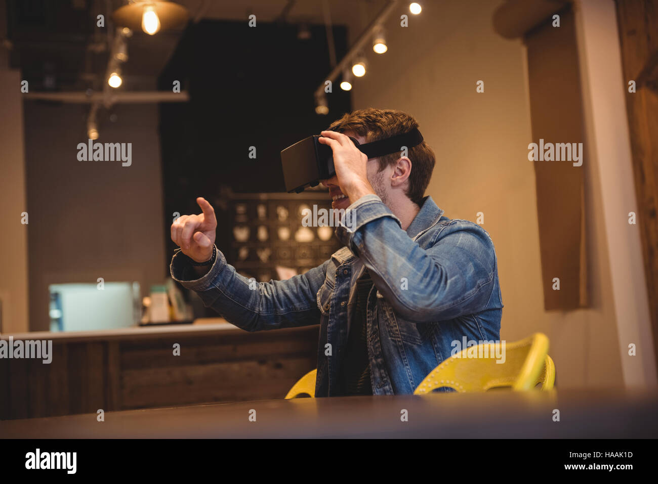 Man using virtual reality headset Stock Photo - Alamy
