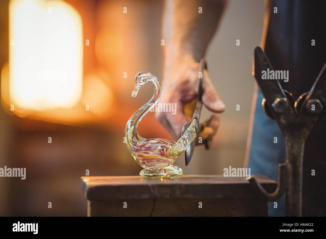 Glassblower shaping a molten glass Stock Photo - Alamy