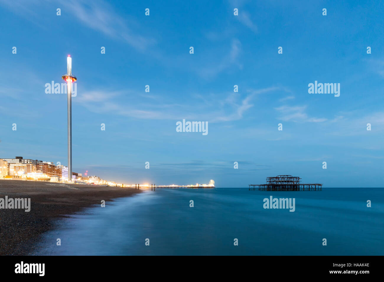Night Photo of Brighton Skyline with old West Pier, Central Pier with ...