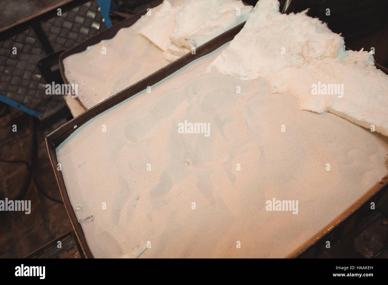 Sand in a metal container at glassblowing factory Stock Photo - Alamy