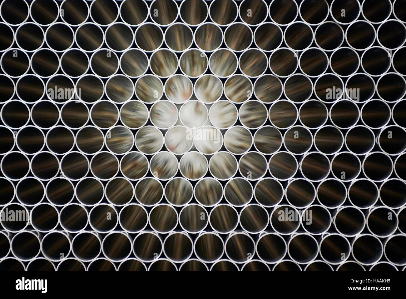 Industrial background. Close up of internal metal pipes in a warehouse ...
