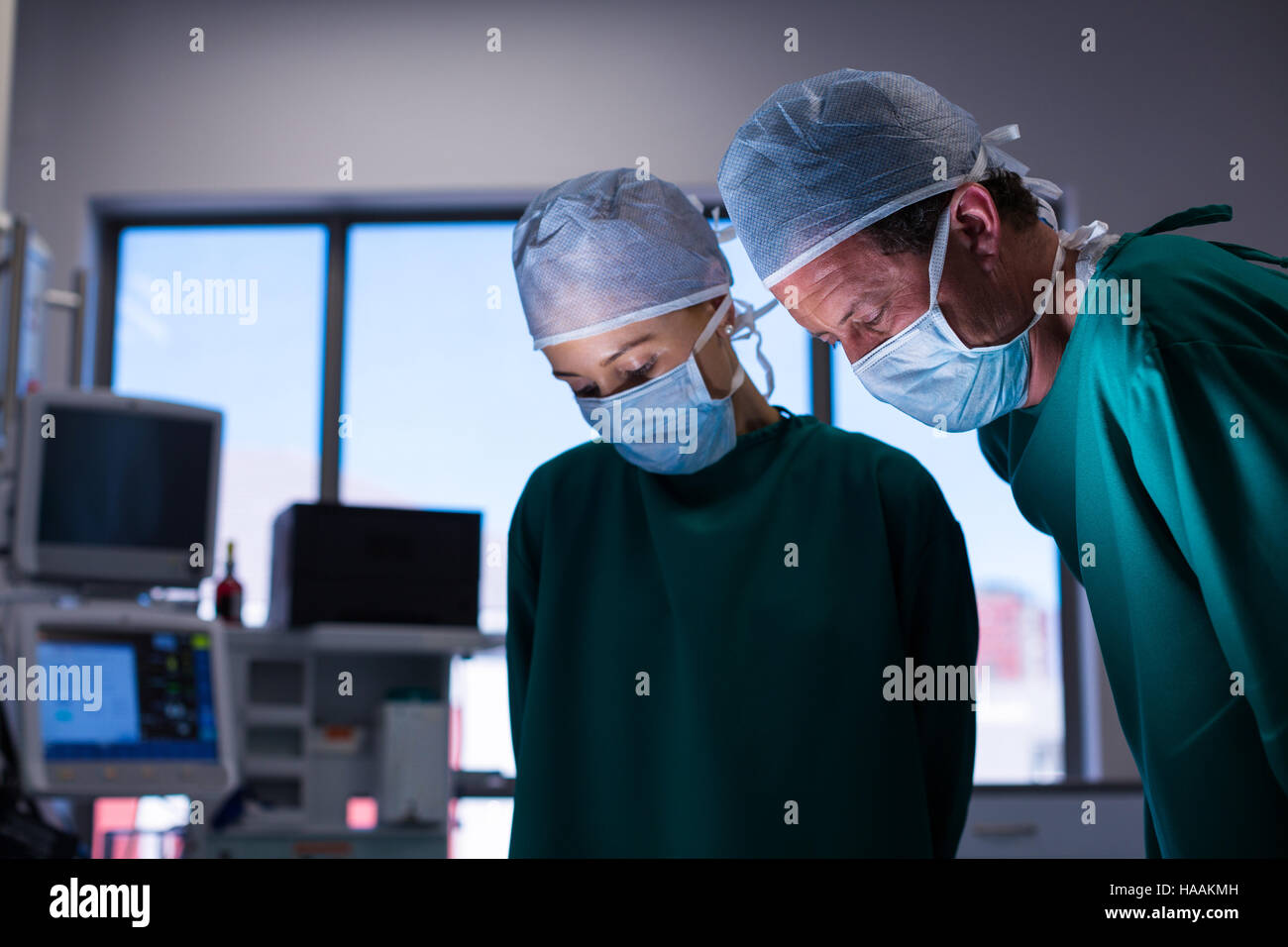 Surgeons performing operation in operation theater Stock Photo - Alamy