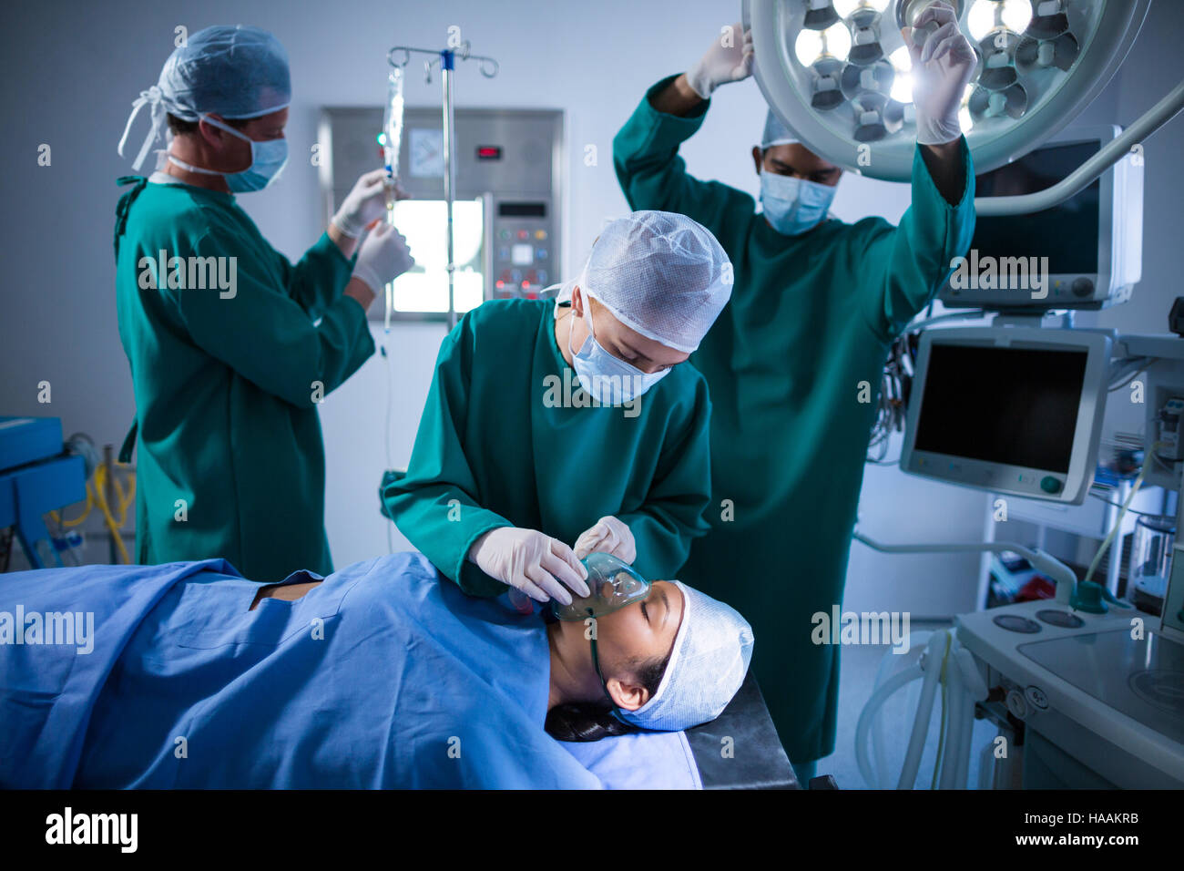 Surgical team adjusting iv drip hi-res stock photography and images - Alamy