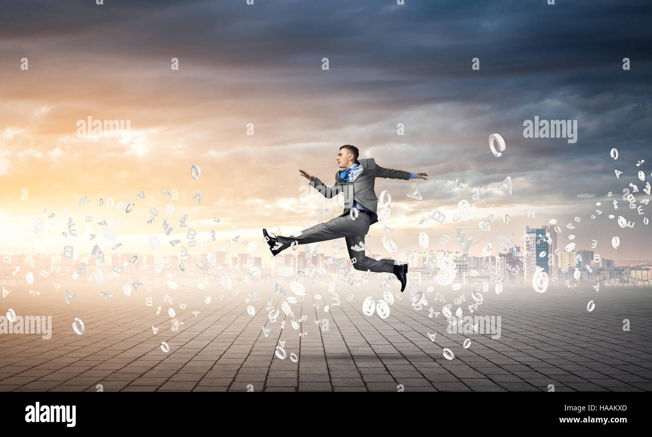 Businessman jumping high Stock Photo - Alamy