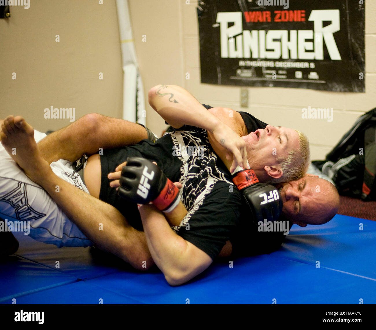 Randy Couture , bottom, practices wrestling with a partner in his ...