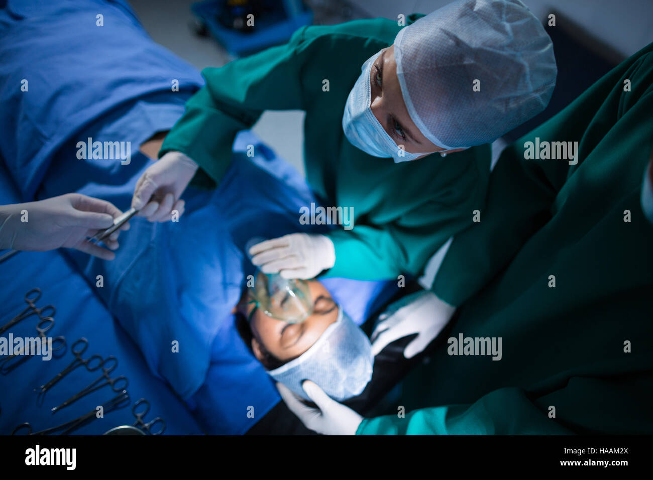 Surgeons performing operation in operation theater Stock Photo - Alamy