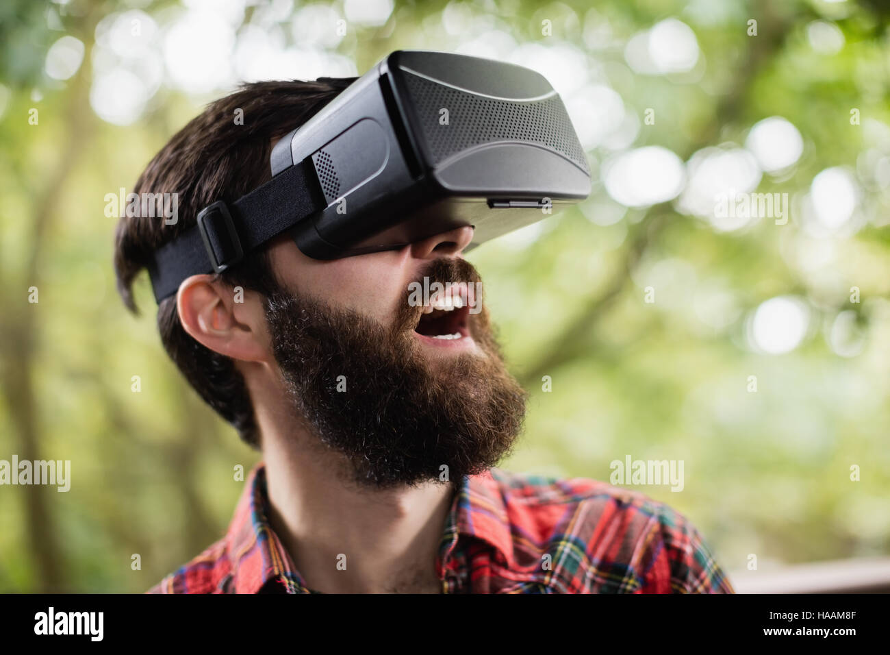 Man using virtual reality headset Stock Photo - Alamy