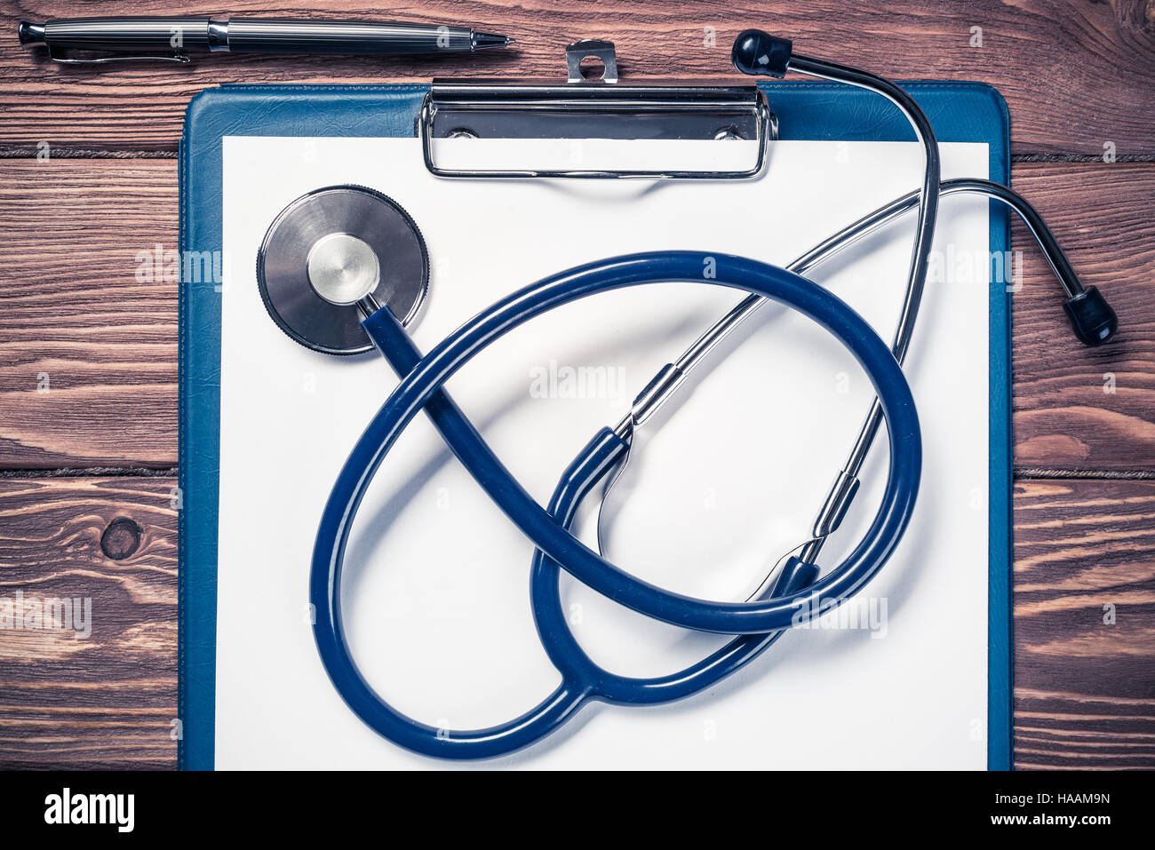 Desk of doctor with medicine things Stock Photo - Alamy