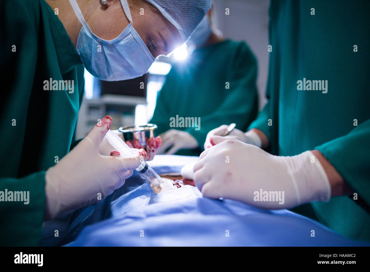 Surgeons performing operation in operation theater Stock Photo - Alamy