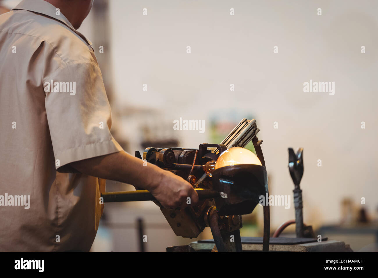 Glassblower forming and shaping a molten glass Stock Photo - Alamy