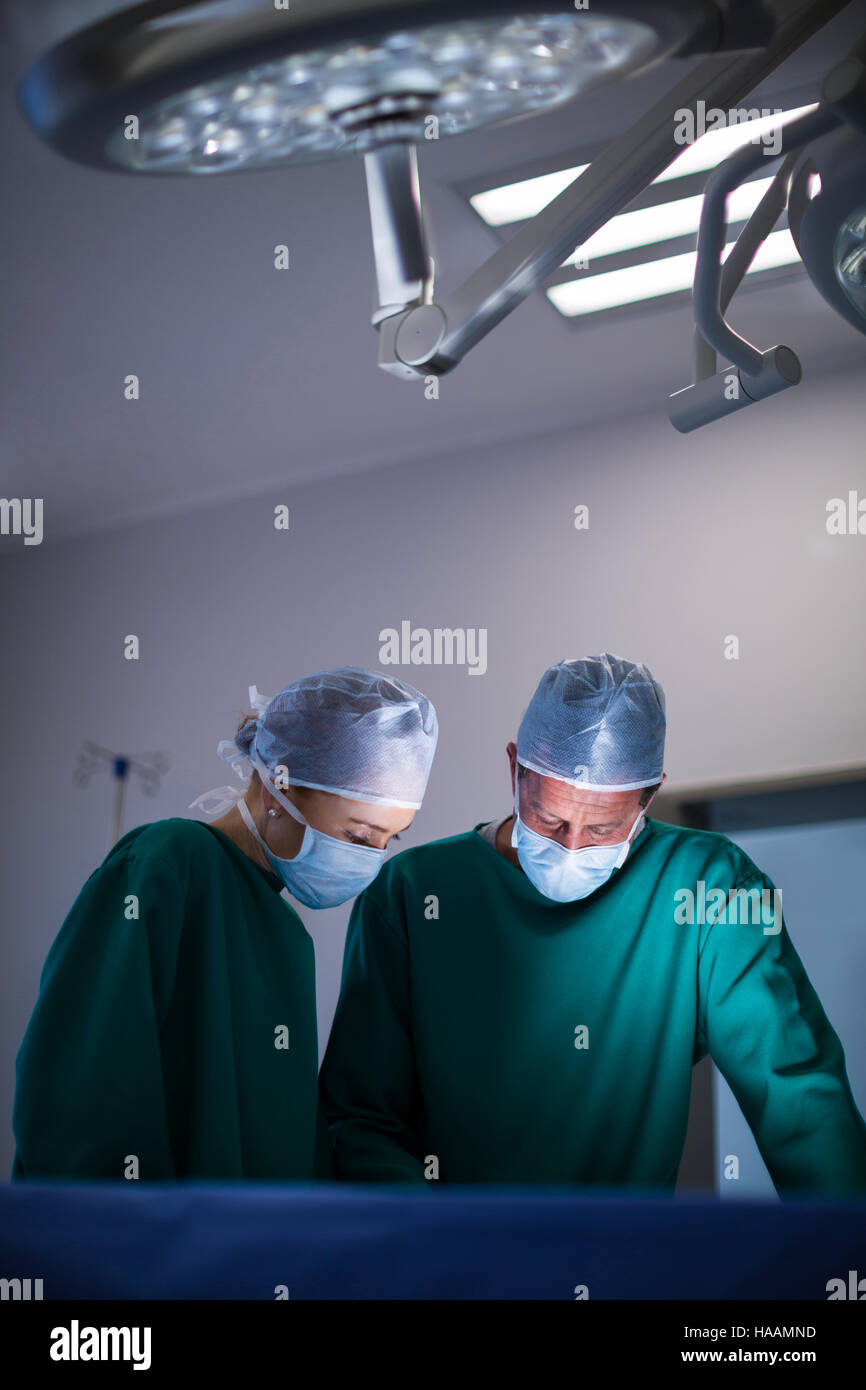 Surgeons performing operation in operation theater Stock Photo - Alamy