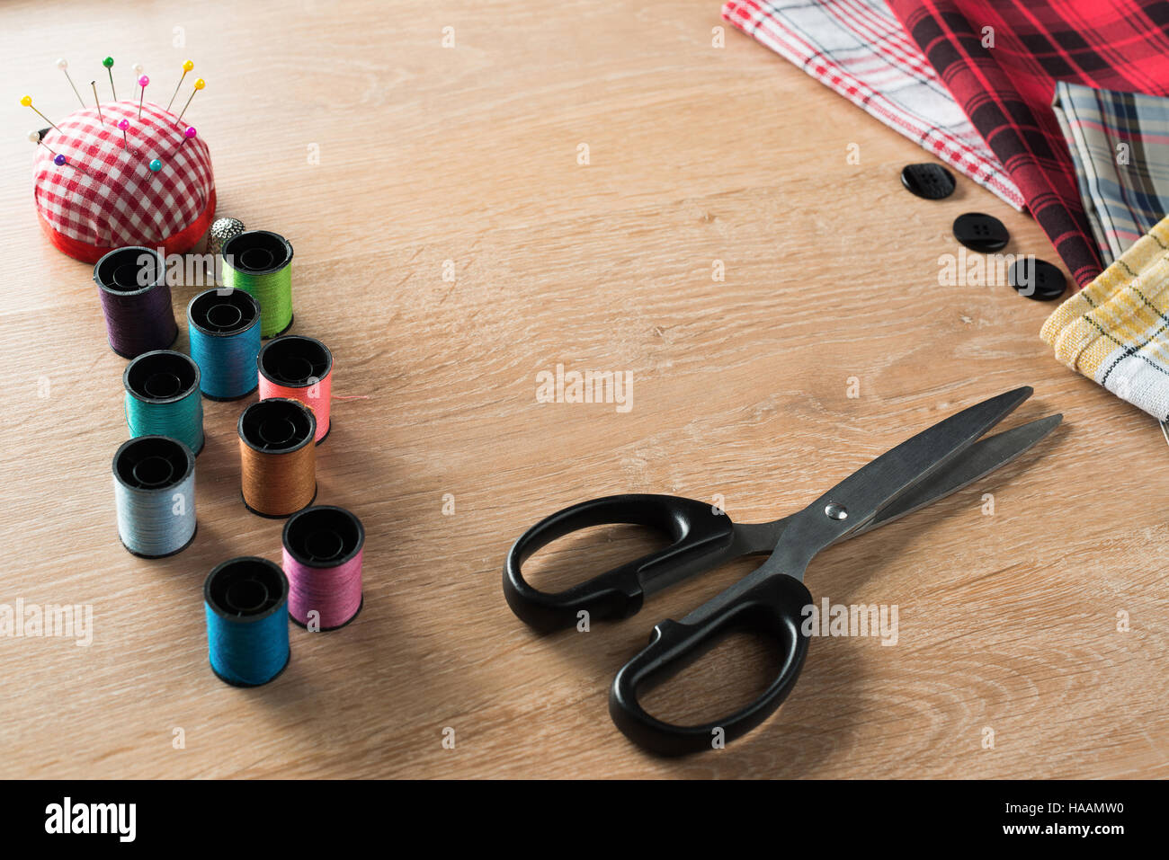 Sewing kit on table Stock Photo - Alamy