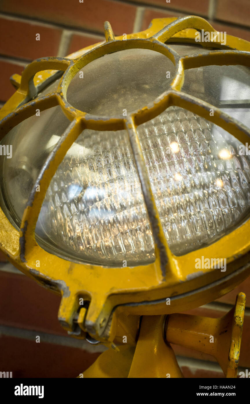 Vintage police or firefighter emergency light closeup with brick wall ...