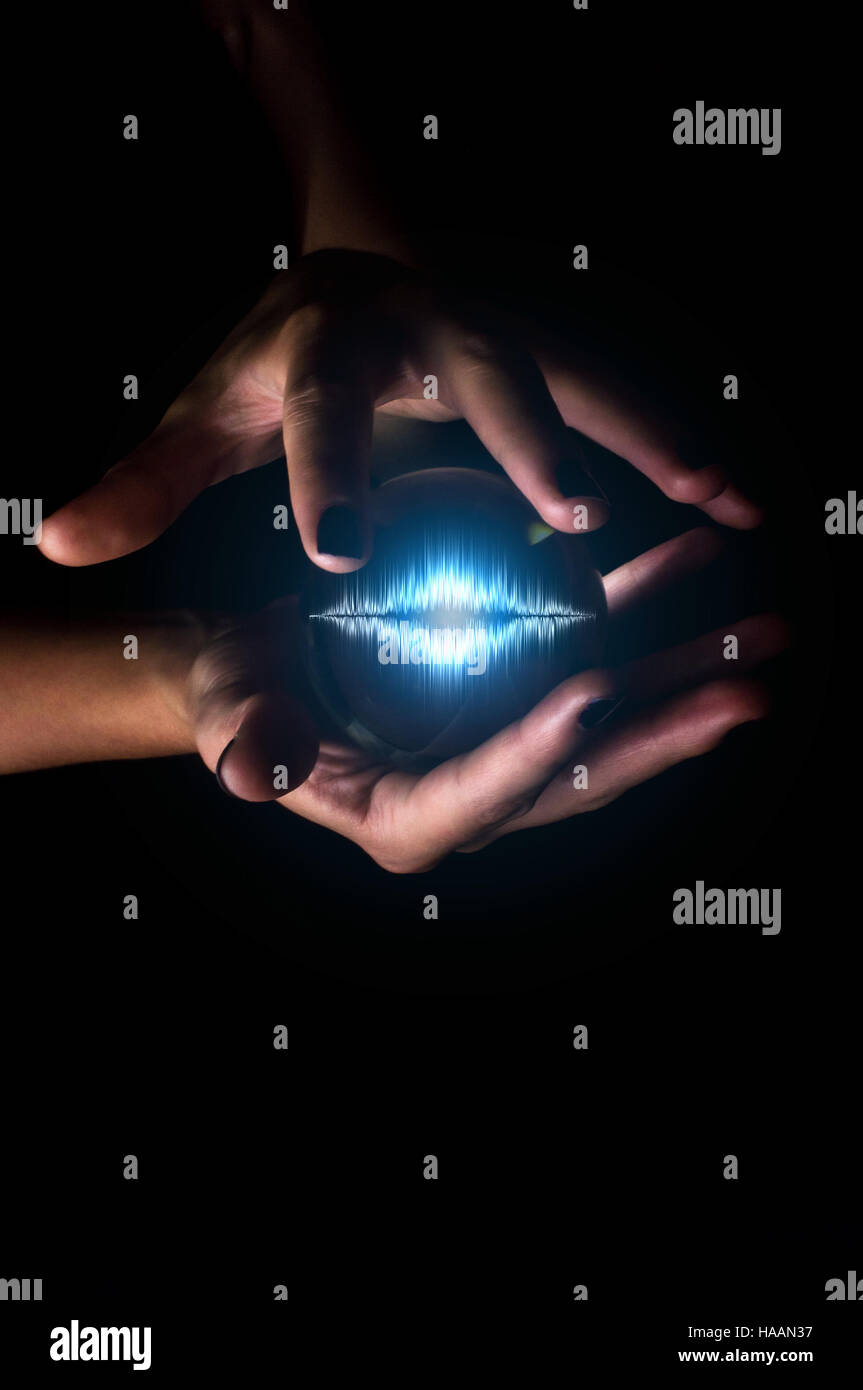Hands holding crystal ball hi-res stock photography and images - Alamy