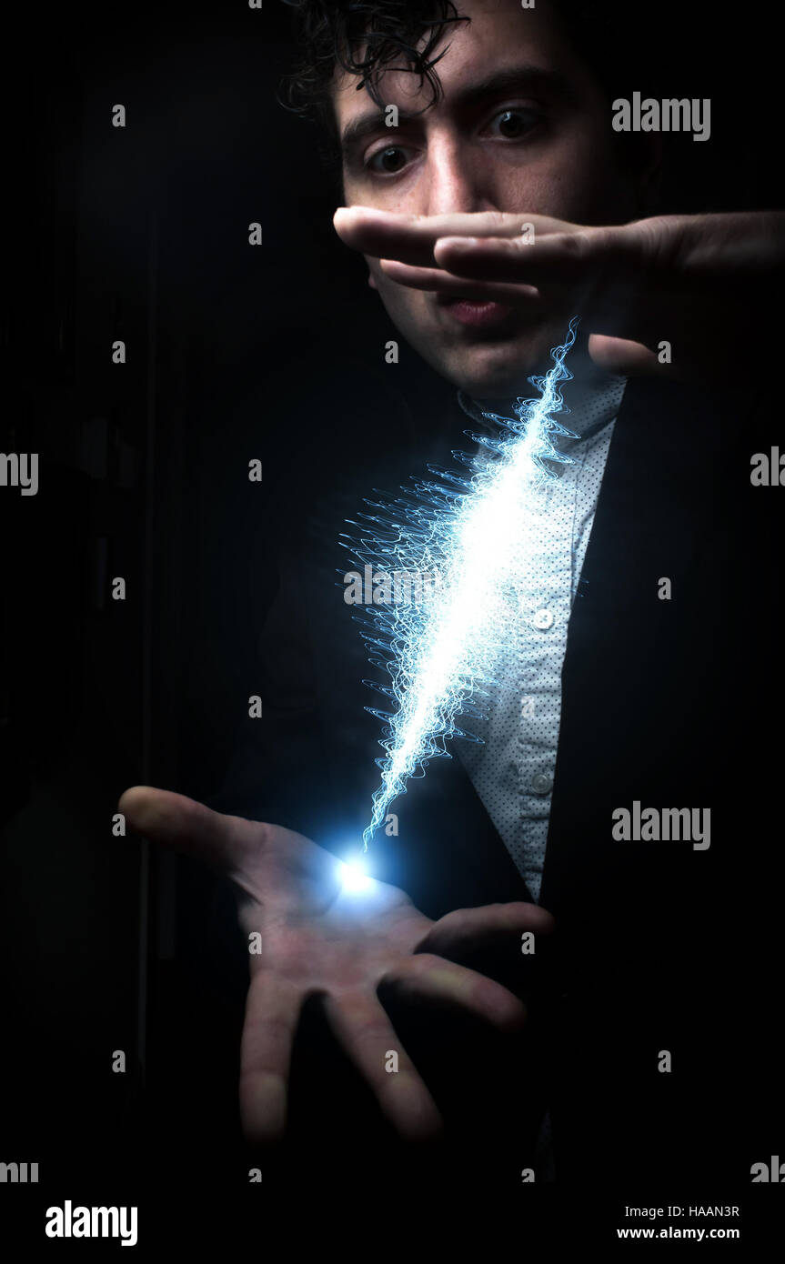 Magician creating sound wave between his hands Stock Photo - Alamy