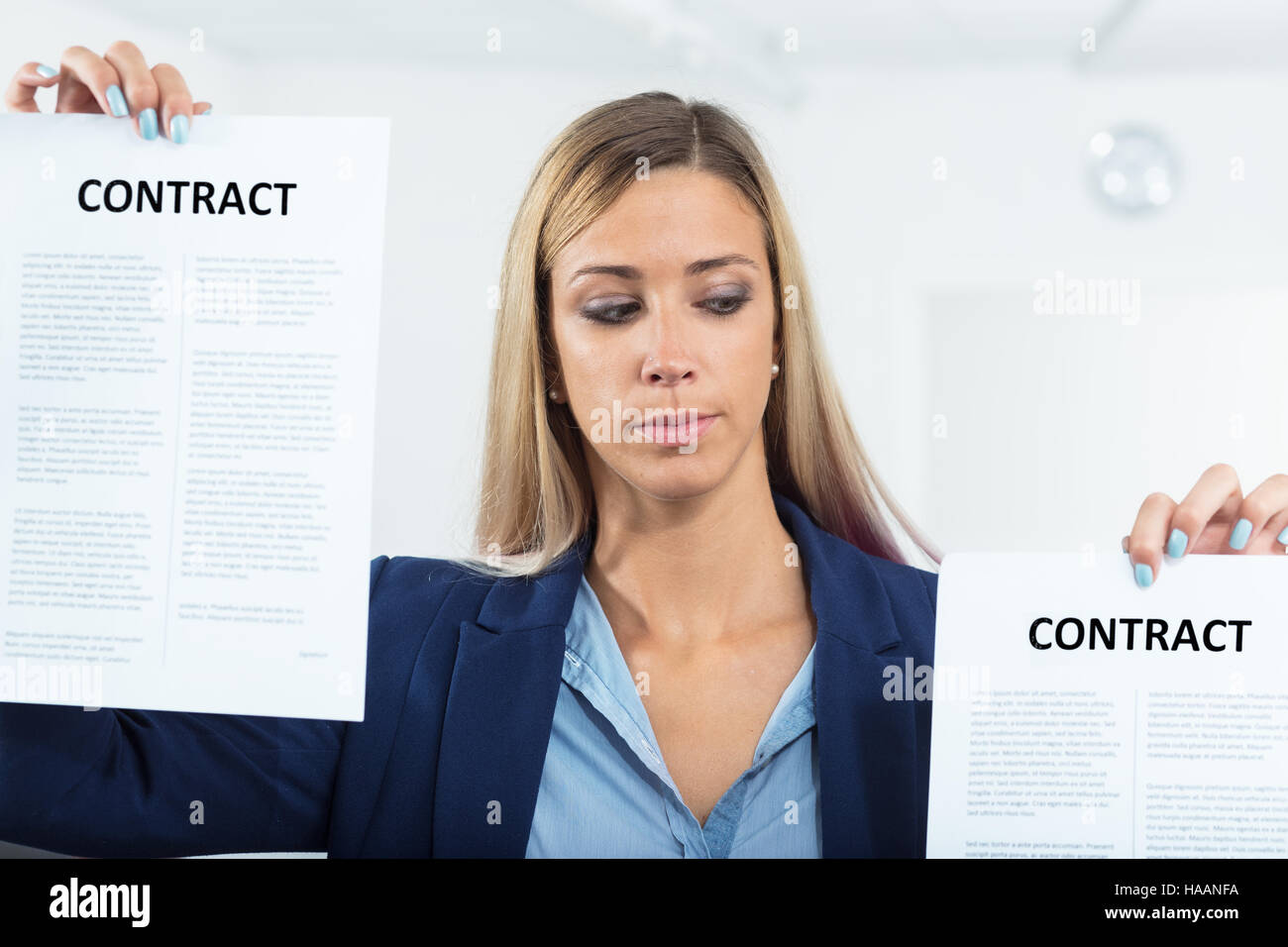 woman considering and choosing the right one between two contracts ...