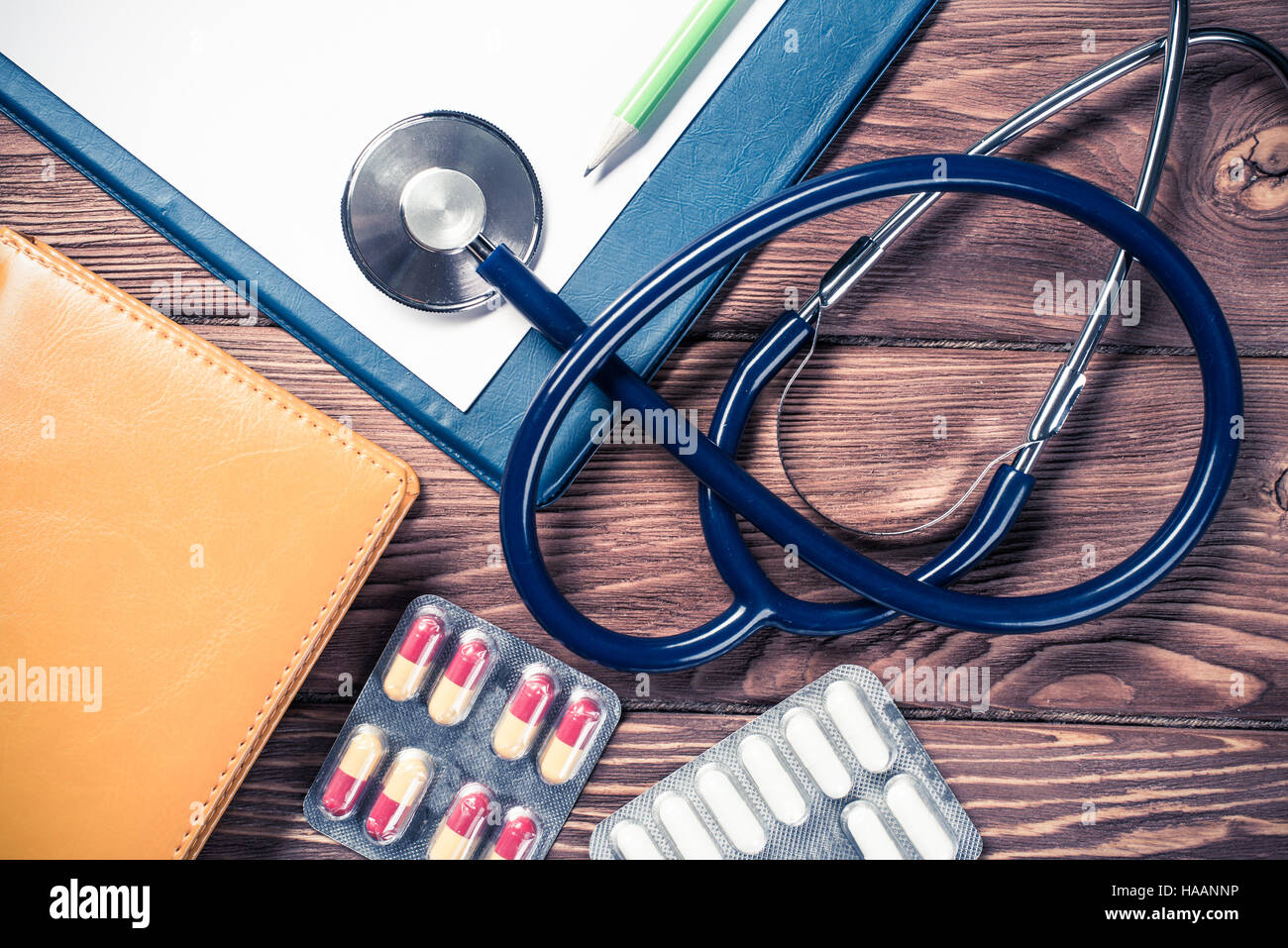 Desk of doctor with medicine things Stock Photo - Alamy