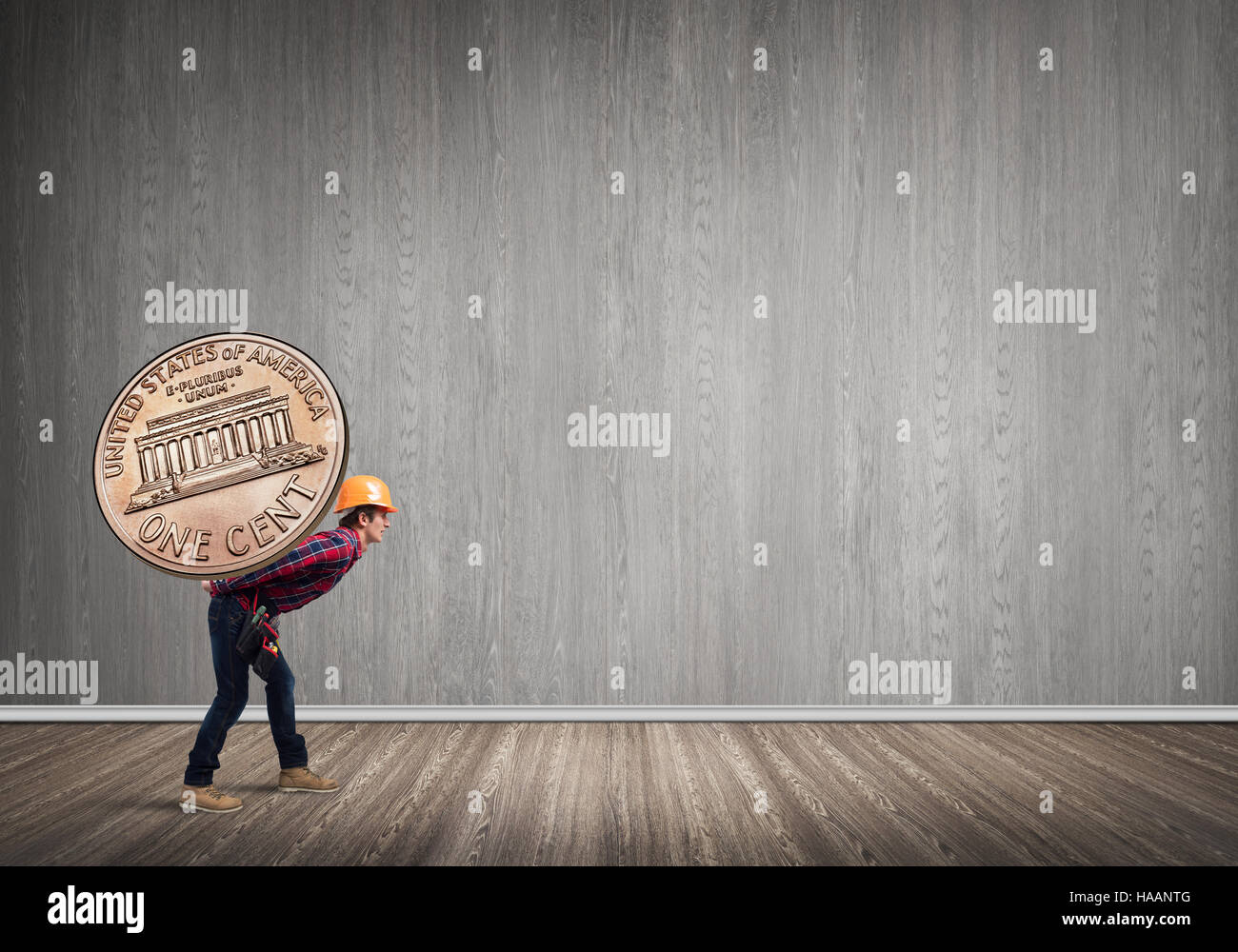 Builder man carry coin Stock Photo - Alamy