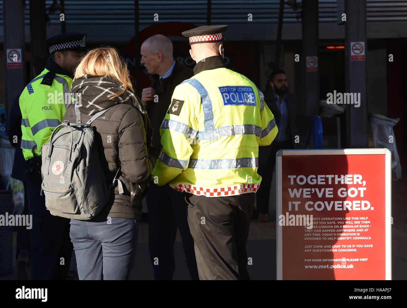A police officer speaks to a commuter at Vauxhall Bus station in south ...