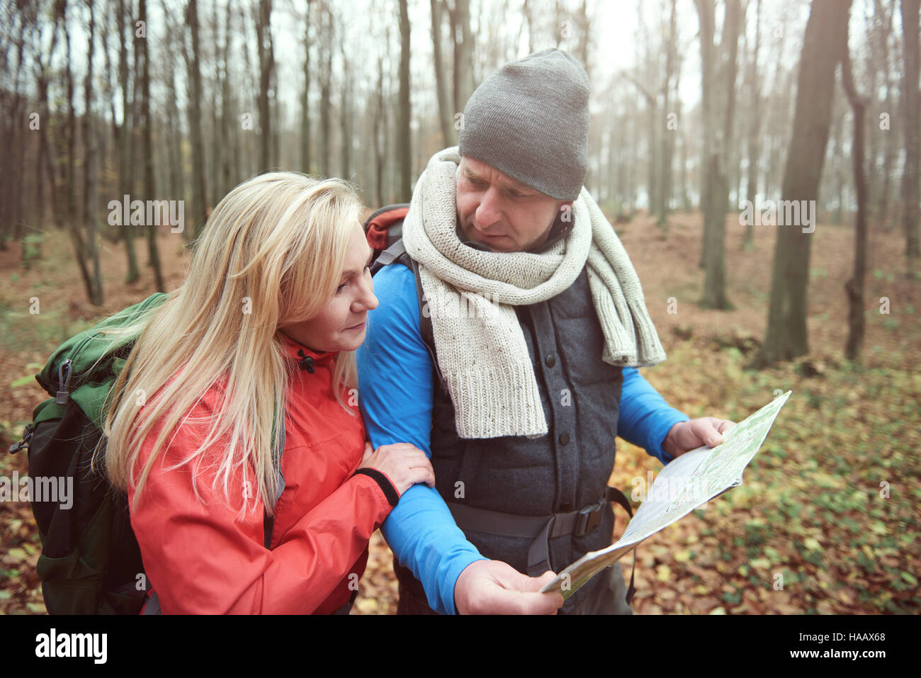 Looking for the way on the map Stock Photo - Alamy