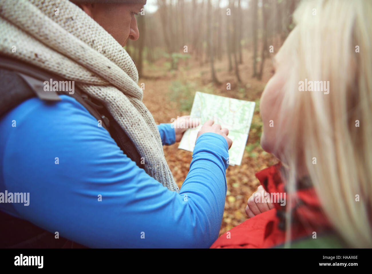 Man pointing on the paper map Stock Photo - Alamy