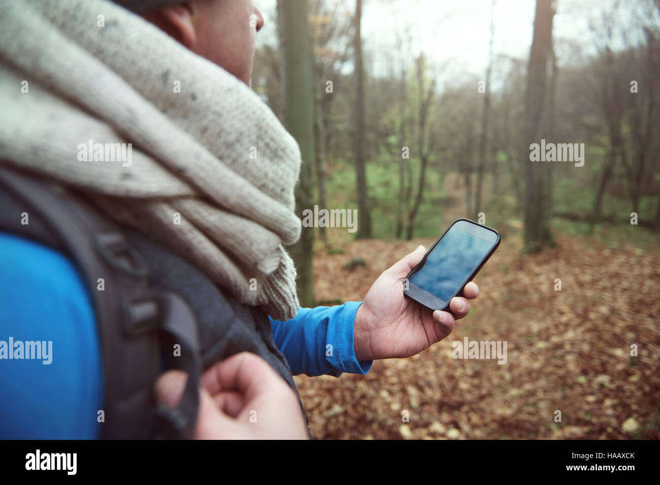 Using mobile phone in the forest Stock Photo - Alamy