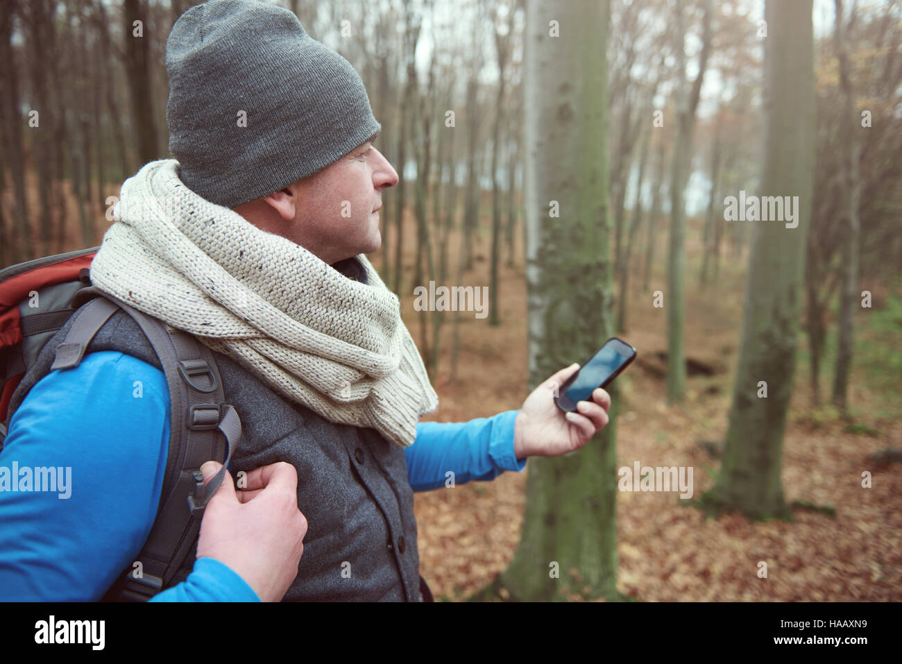 Man looking for the signal in the forest Stock Photo - Alamy