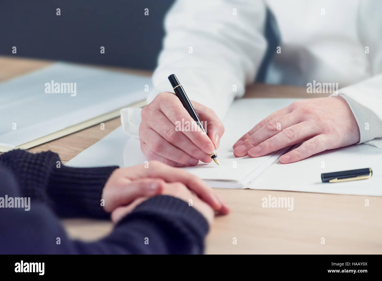 Doctor taking patient notes hi-res stock photography and images - Alamy