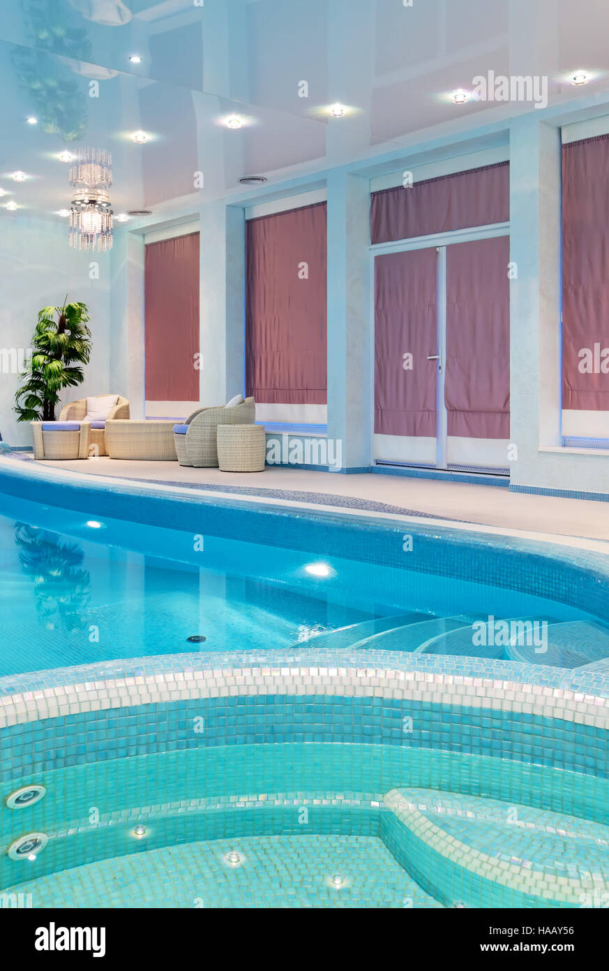 Relaxation spa zone near blue mosaic swimming pool Stock Photo - Alamy