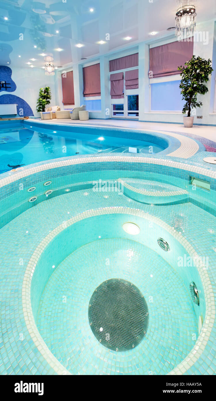 Round swimming pool design with blue mosaic Stock Photo - Alamy