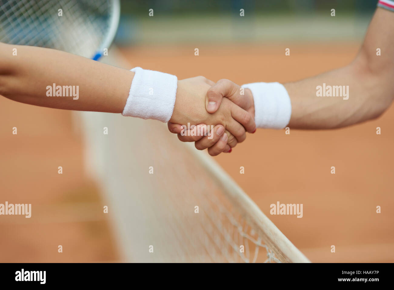 Handshake after good tennis game Stock Photo - Alamy