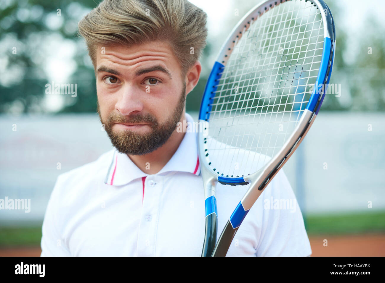Handsome man with the racket Stock Photo - Alamy
