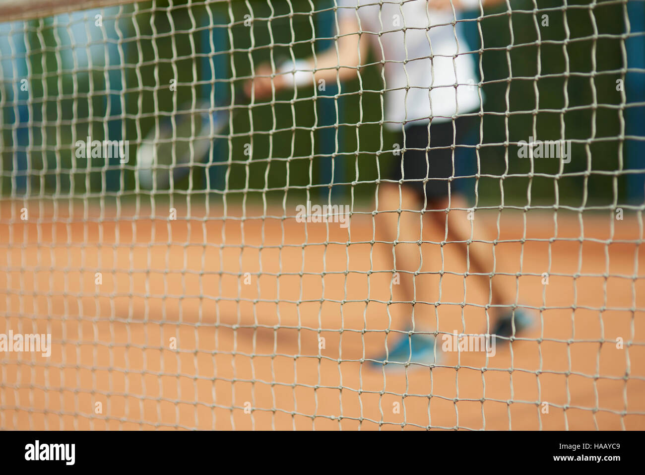 behind the net is a player Stock Photo - Alamy