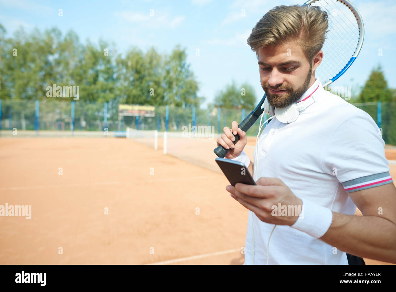 The player is chatting by the phone Stock Photo - Alamy