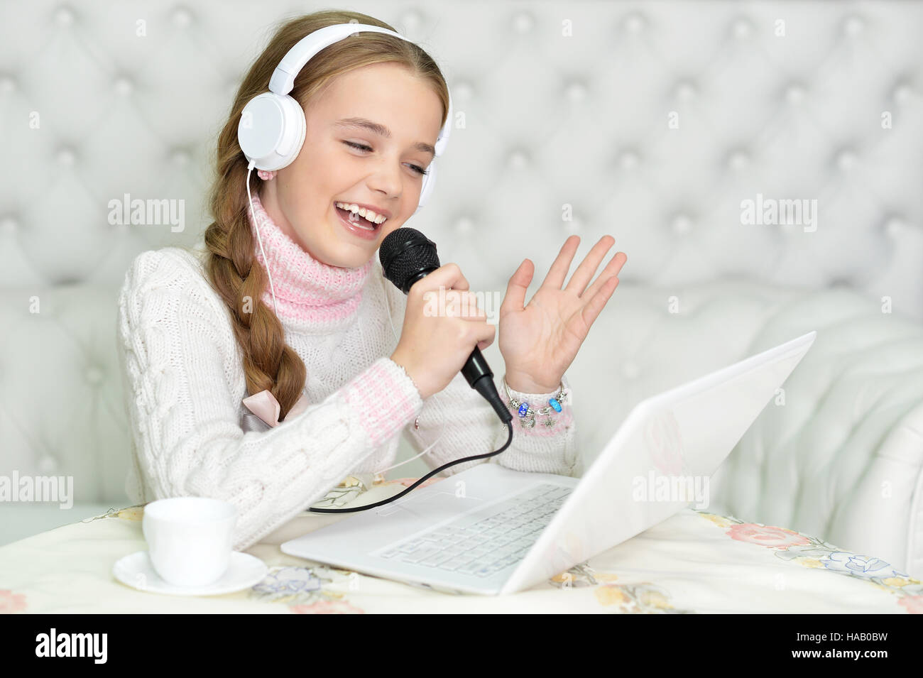 Girl singing karaoke Stock Photo - Alamy
