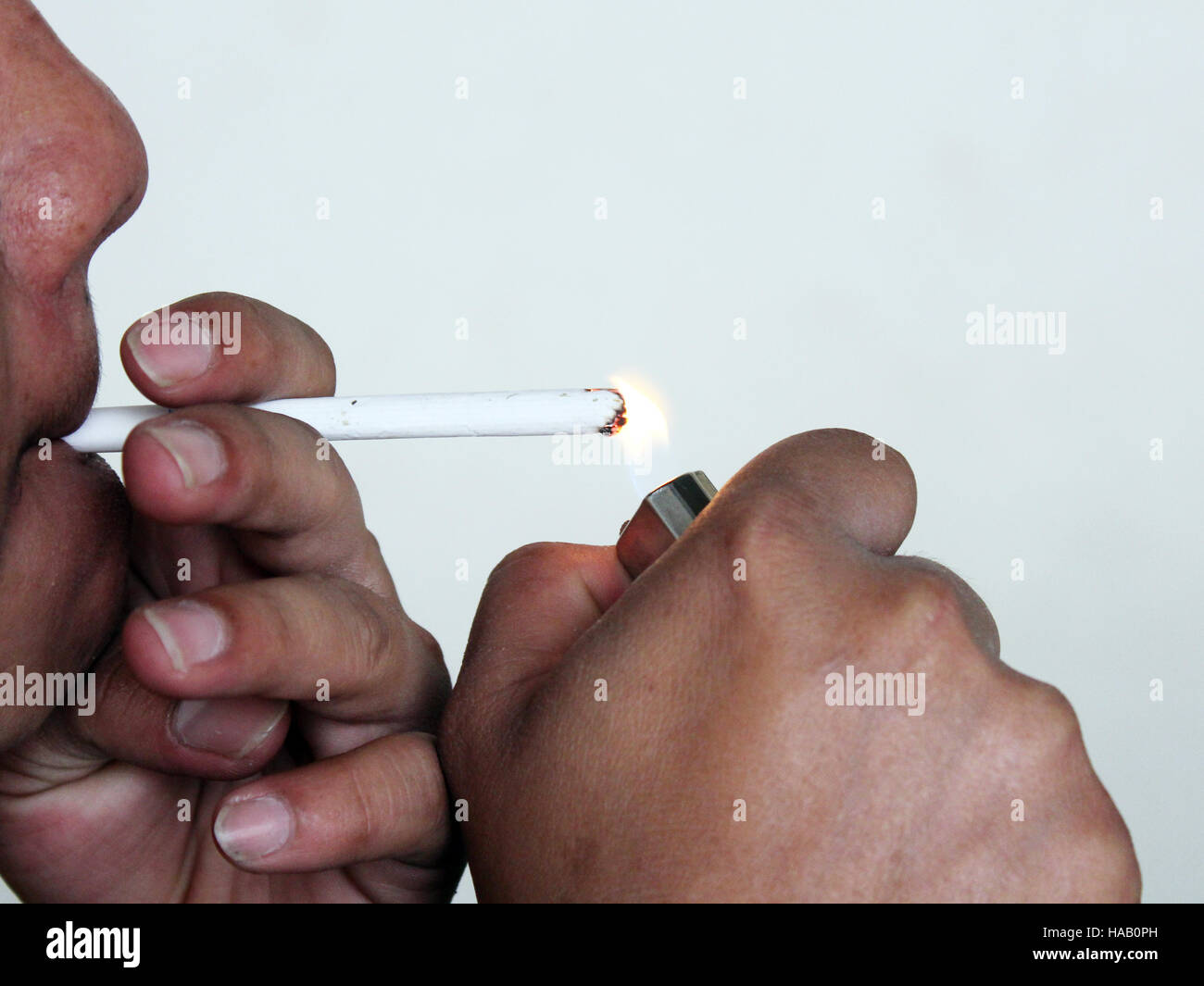 closeup of man smoking cigarette and enjoying smoke Stock Photo - Alamy