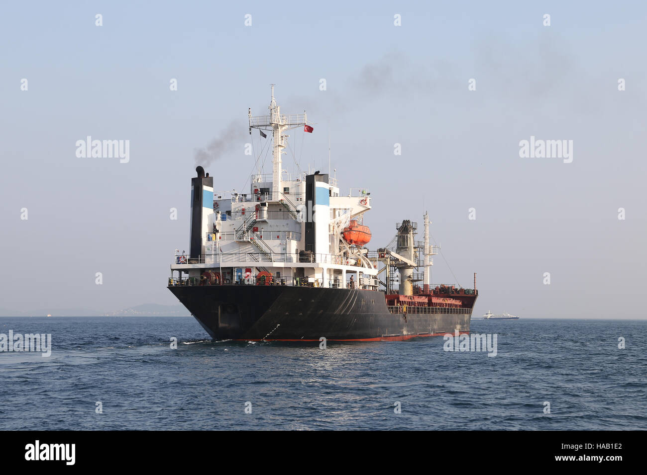 A cargo ship carrying goods between ports Stock Photo - Alamy