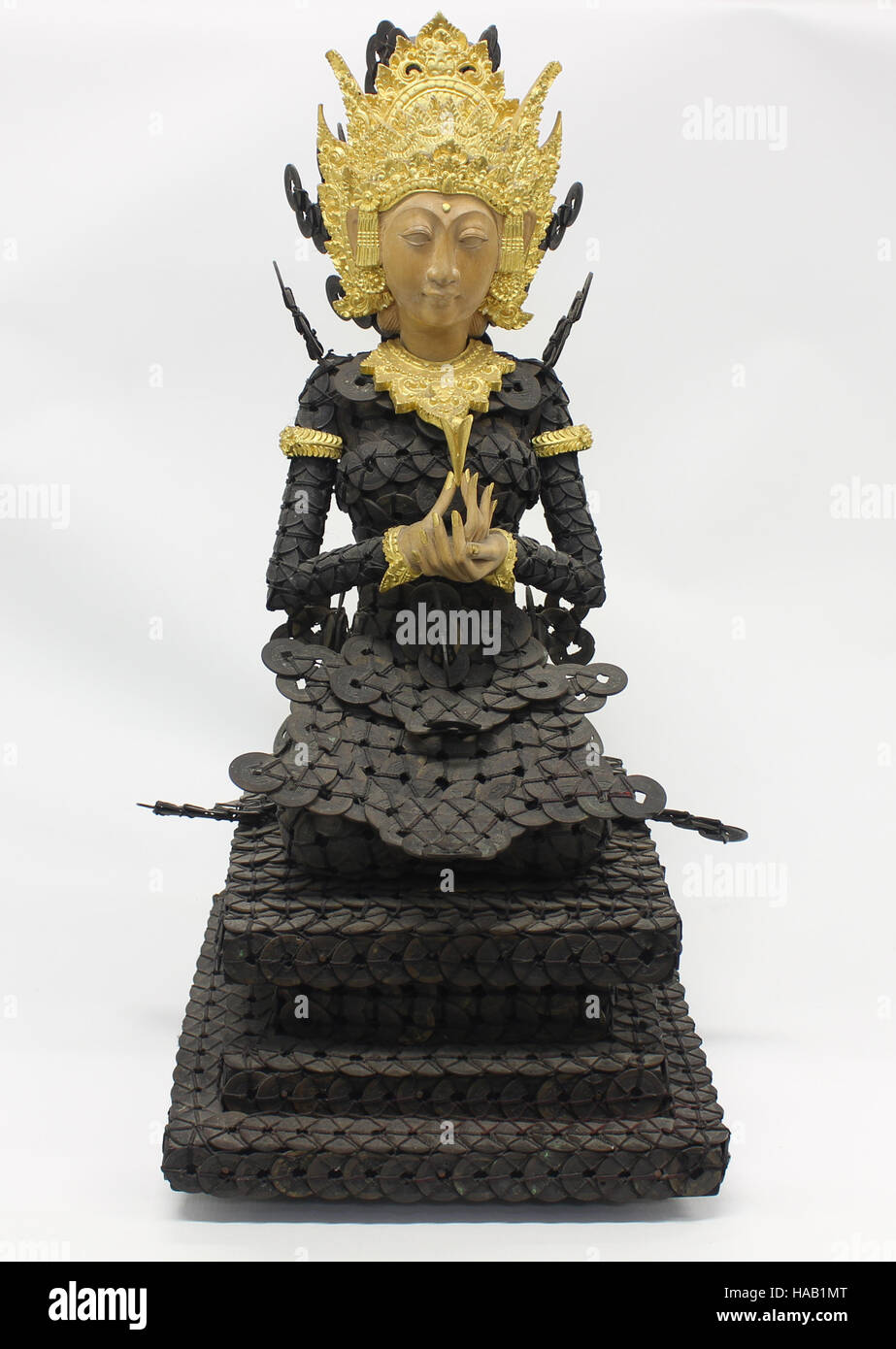 Balinese dancer statue made Ancient Coins background Stock Photo - Alamy